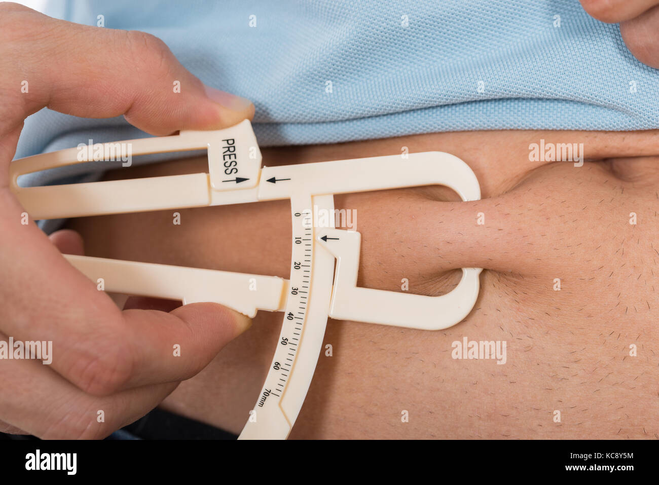 Measuring belly man hi-res stock photography and images - Alamy