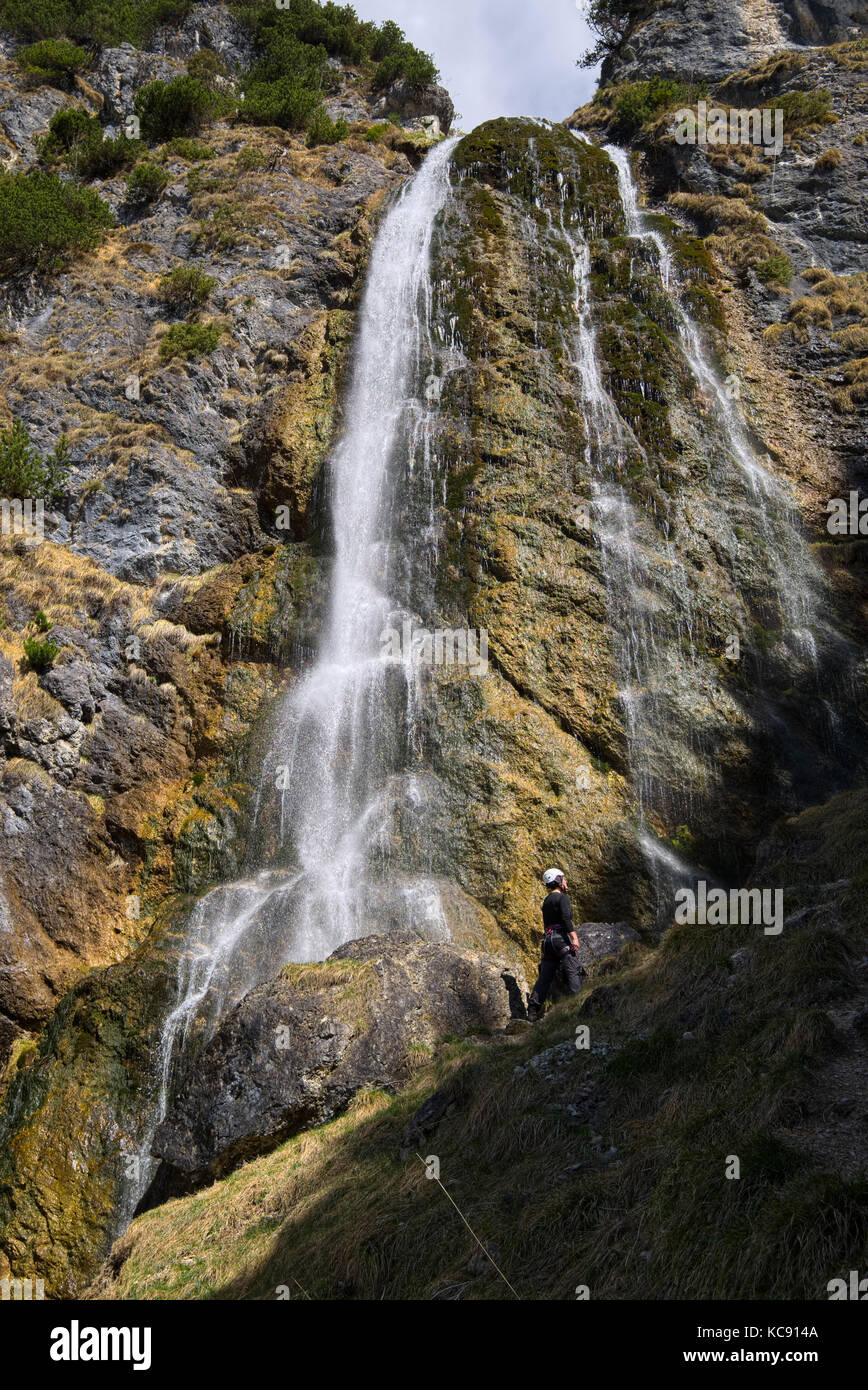 climber at the base of Dalfaz waterfall, Dalfazer Wasserfall, Maurach ...