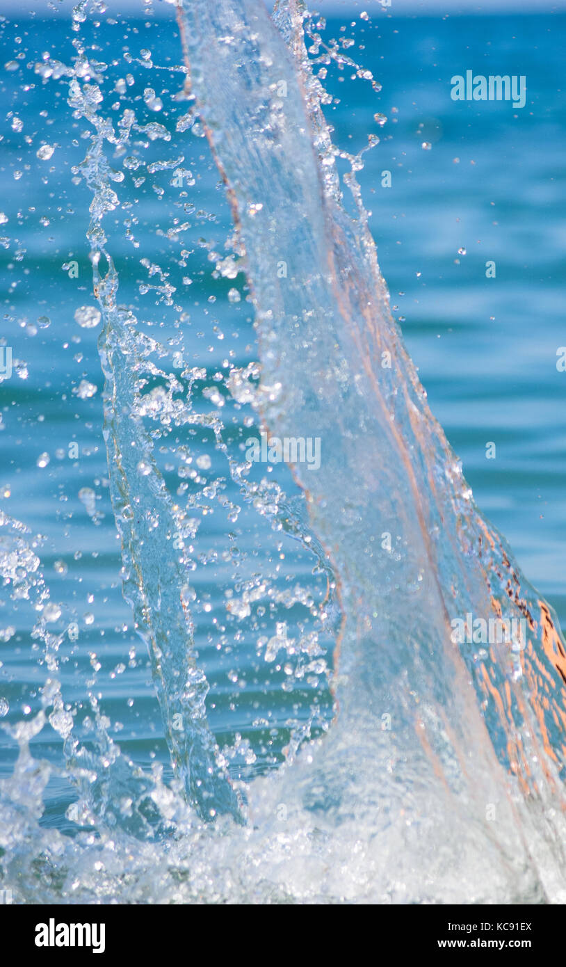 large transparent splashes sea water on a warm Sunny day, close-up ...