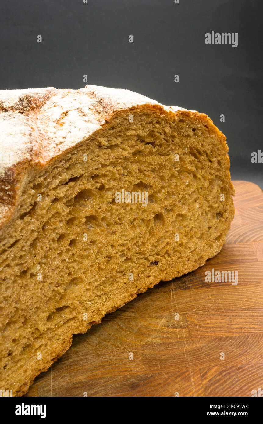 cut malt bread handmade on wooden background Stock Photo - Alamy