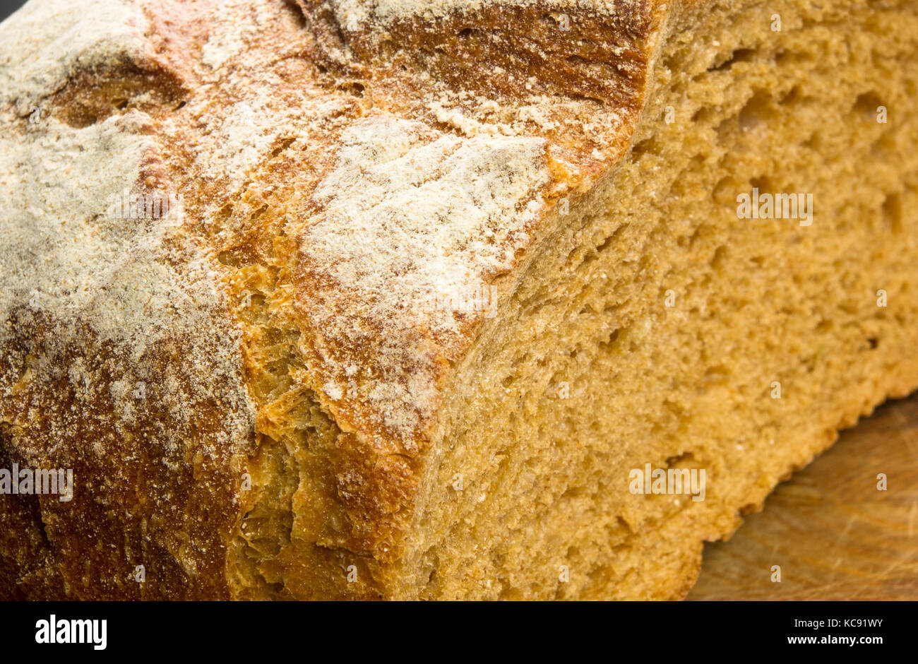 cut malt bread handmade on wooden background Stock Photo - Alamy