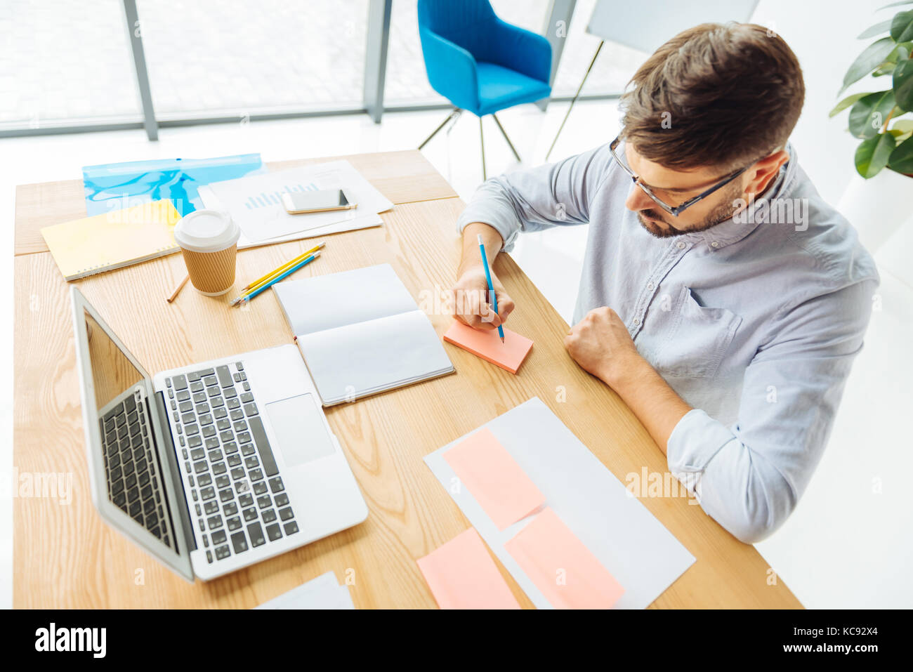 Top view of serious man that doing his work Stock Photo - Alamy