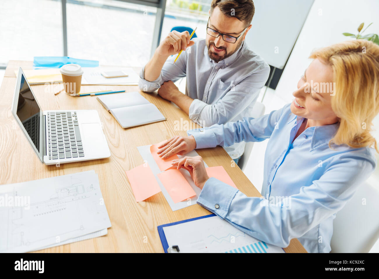 Two coworkers working at their project Stock Photo - Alamy