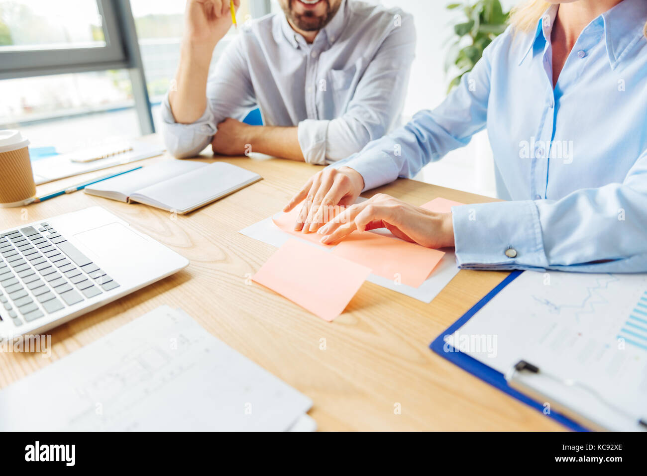 Competent woman working with stickers Stock Photo - Alamy