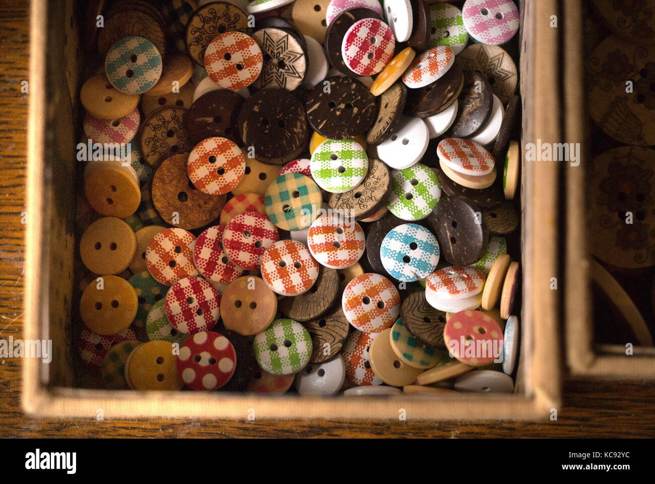 Box full of gingham buttons Stock Photo - Alamy