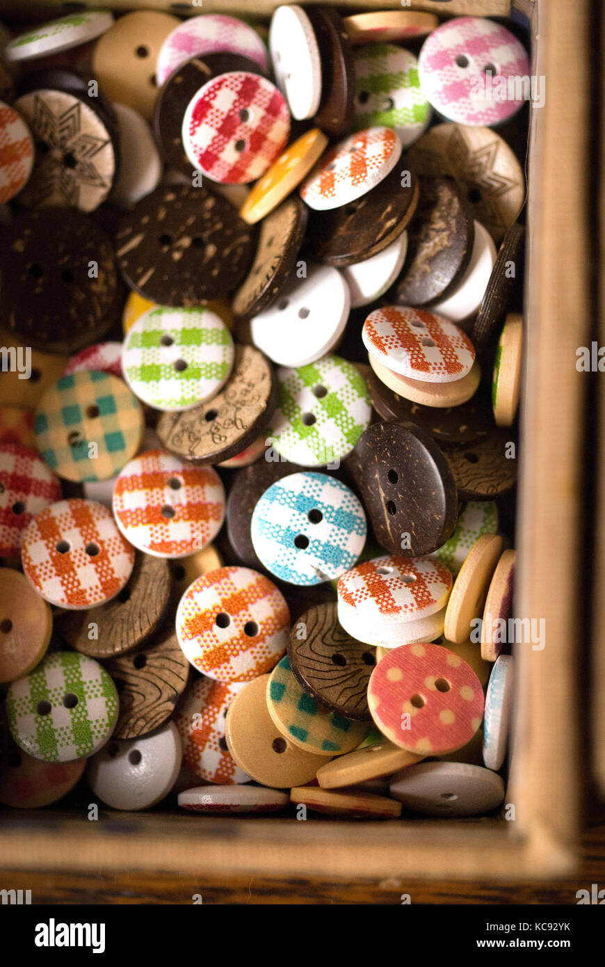 Box full of gingham buttons Stock Photo - Alamy