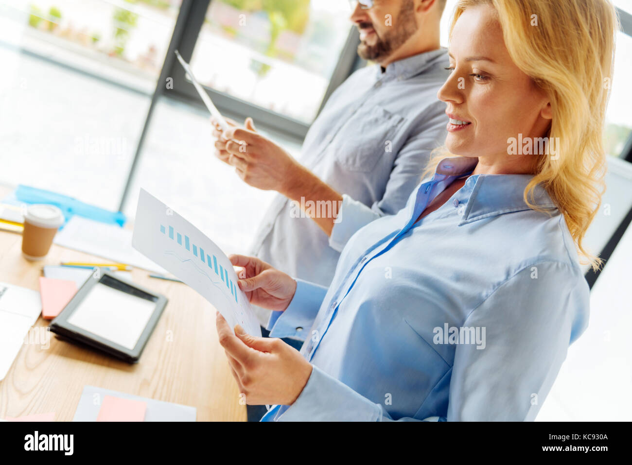 Profile photo of busy worker that checking documents Stock Photo - Alamy