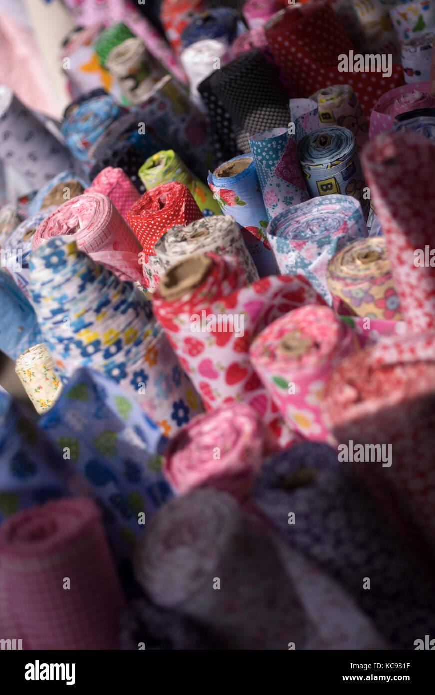Rolls of cloth at a a market Stock Photo - Alamy