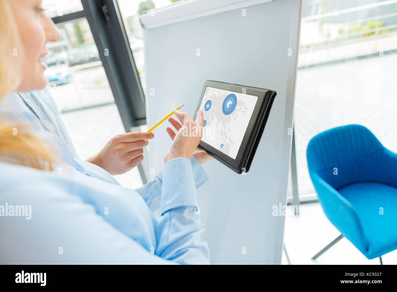 Serious woman standing in semi position Stock Photo - Alamy