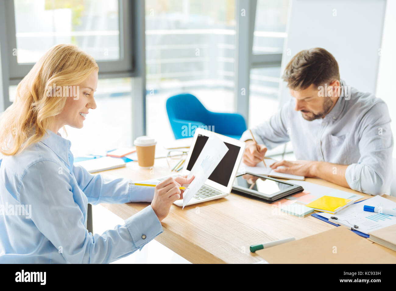 Busy office workers sitting at their places Stock Photo - Alamy