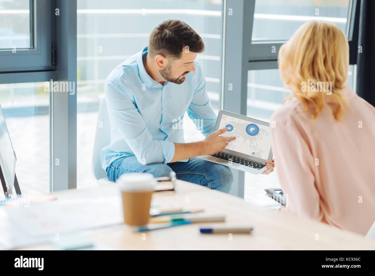 Competent manager explaining working diagram Stock Photo - Alamy
