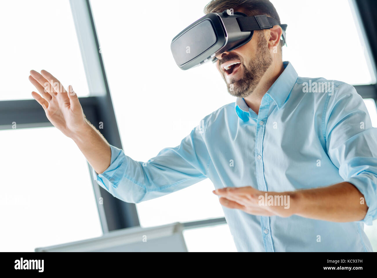 Low angle of smiling man that being at home Stock Photo - Alamy