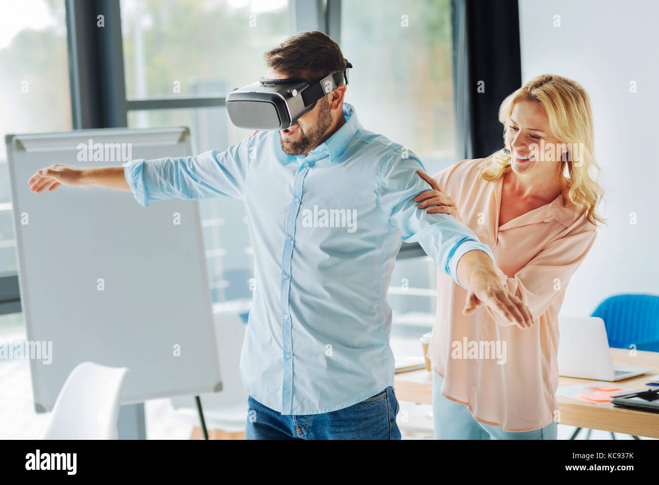 Relaxed man raising both arms Stock Photo - Alamy