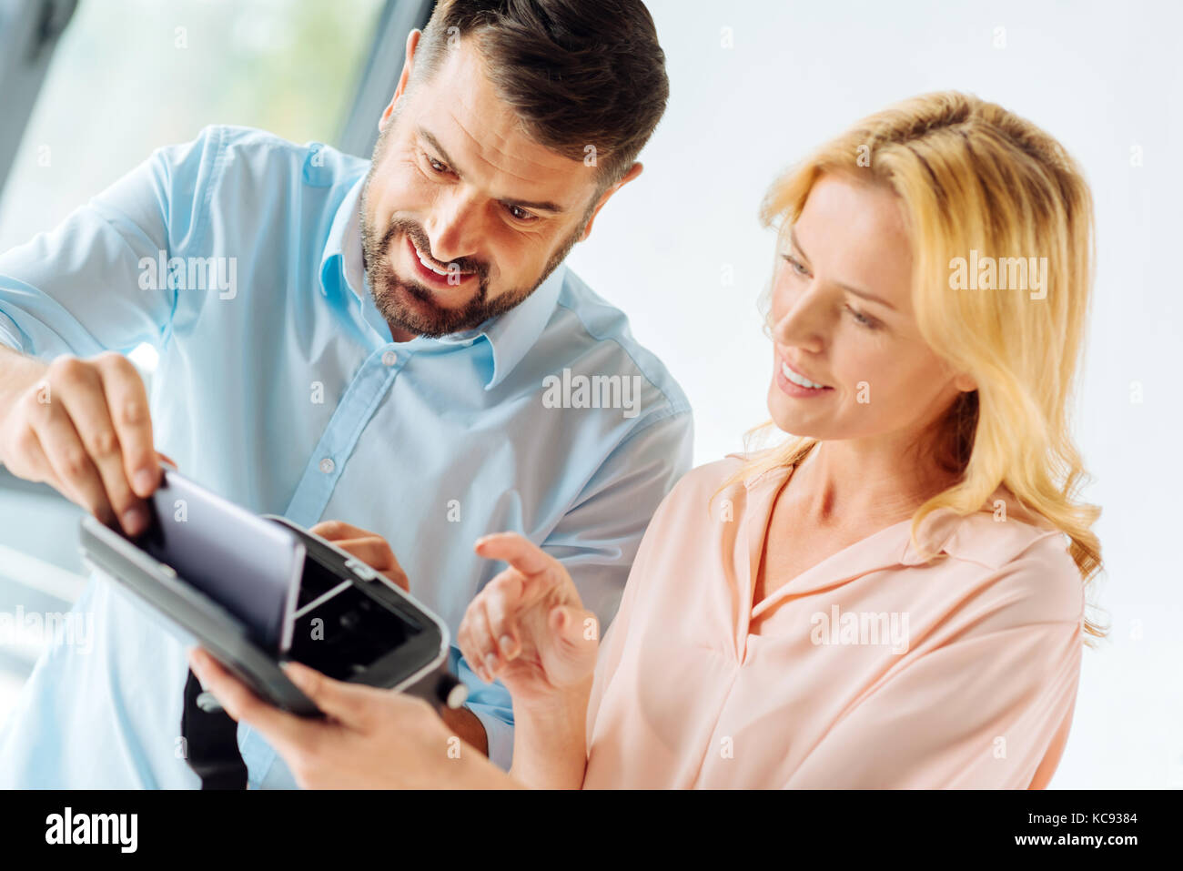 Enigmatical woman looking at special glasses Stock Photo - Alamy