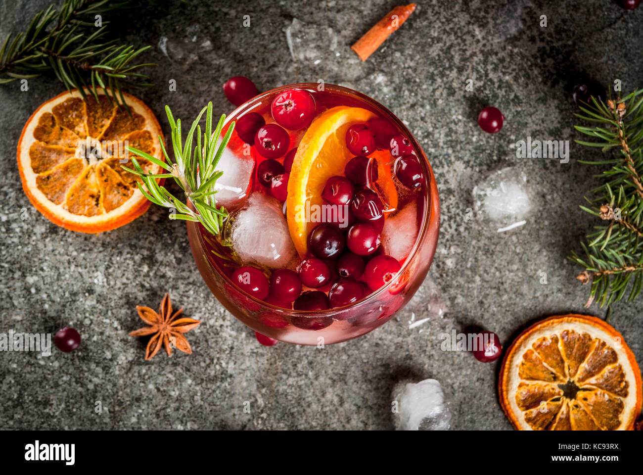 Christmas winter drinks. Cold cocktail with cranberries, orange ...