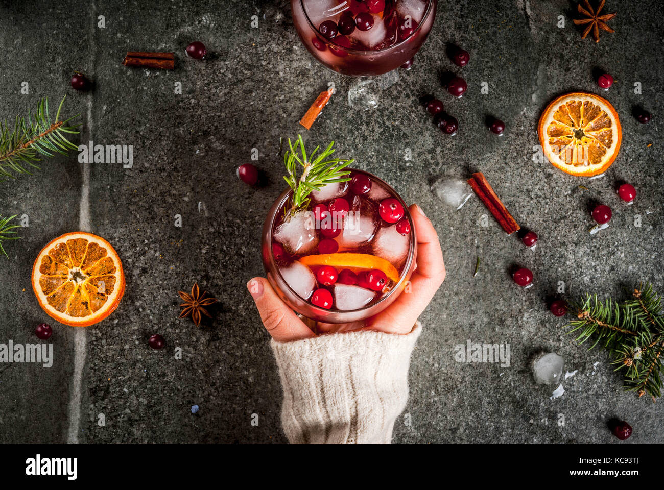 Christmas winter drinks. Girl drinks cold cocktail with cranberries ...