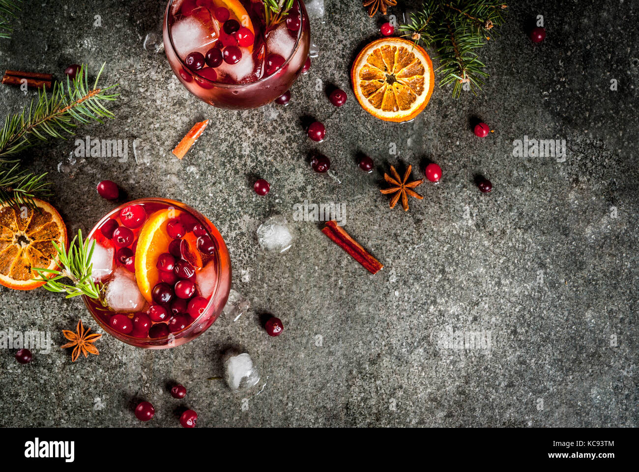Christmas winter drinks. Cold cocktail with cranberries, orange ...