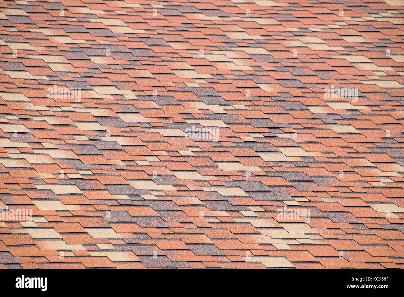 Roof from multi-colored bituminous shingles. Patterned bitumen shingles ...