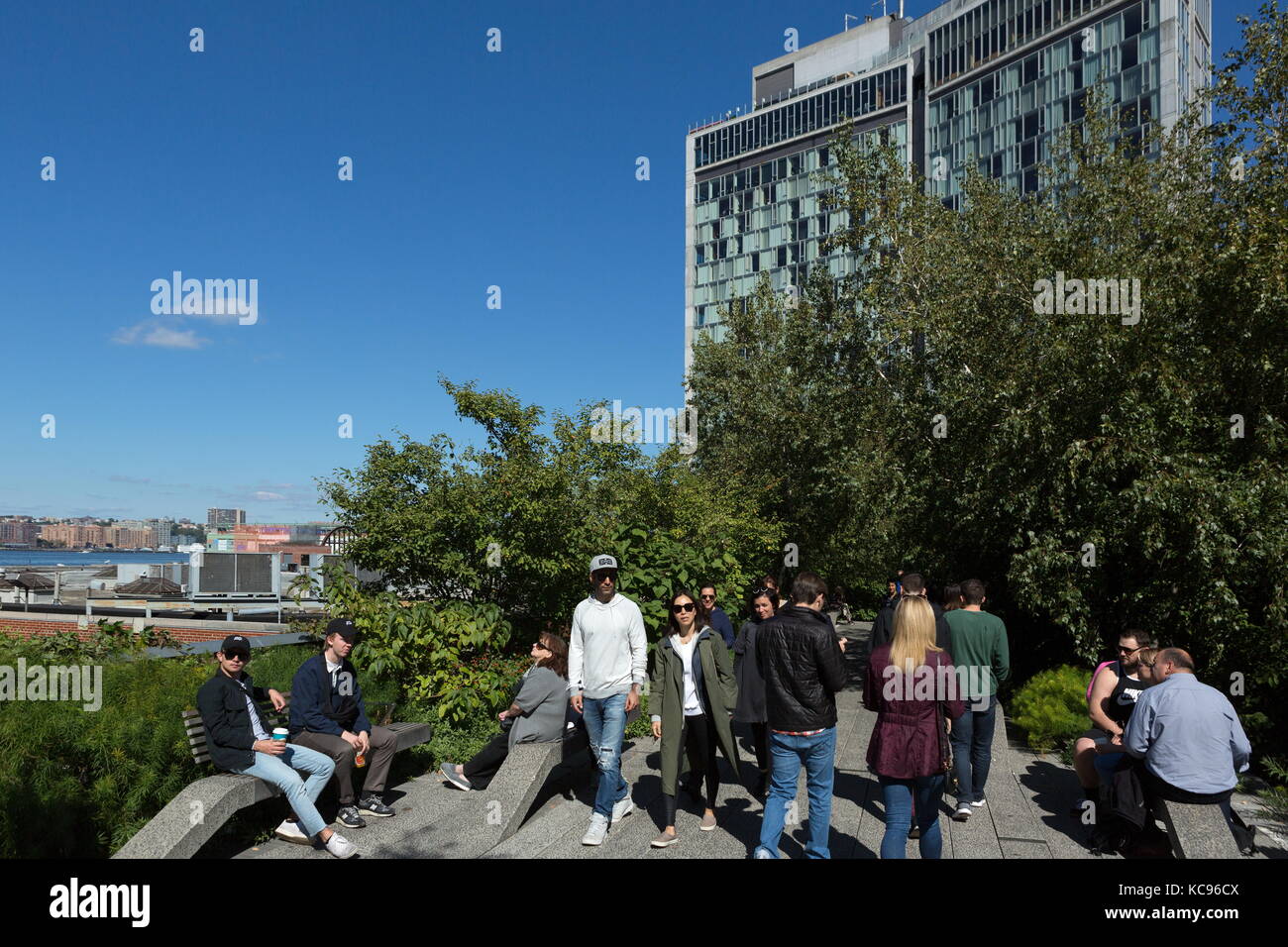Pedestrians walk along the High Line in New York, New York on October ...