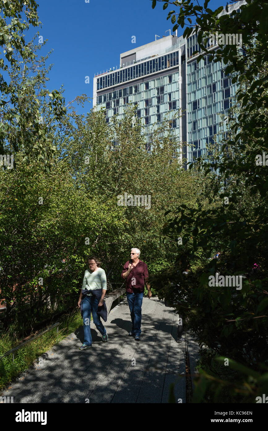 Pedestrians walk along the High Line in New York, New York on October ...