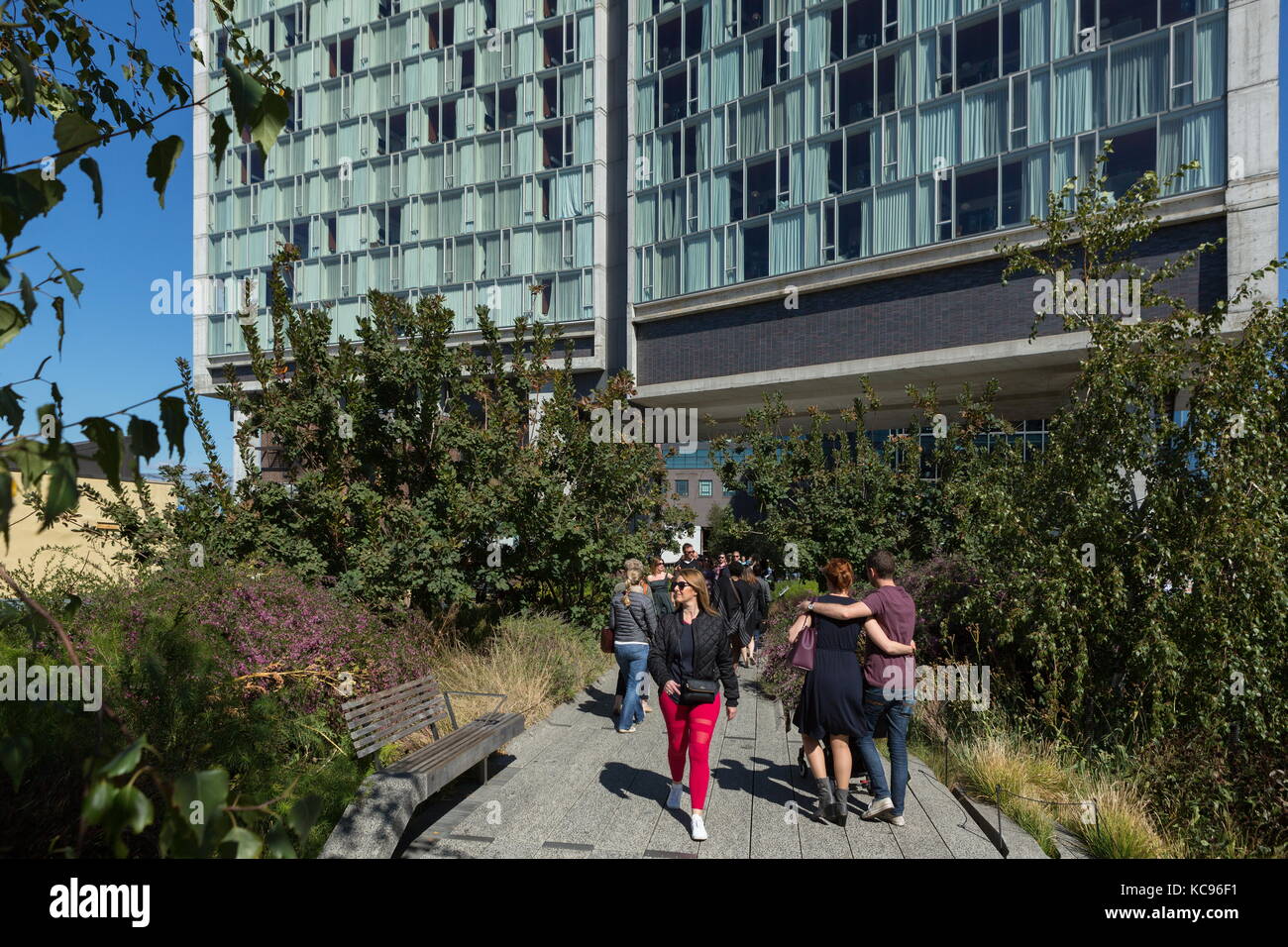 Pedestrians walk along the High Line in New York, New York on October ...