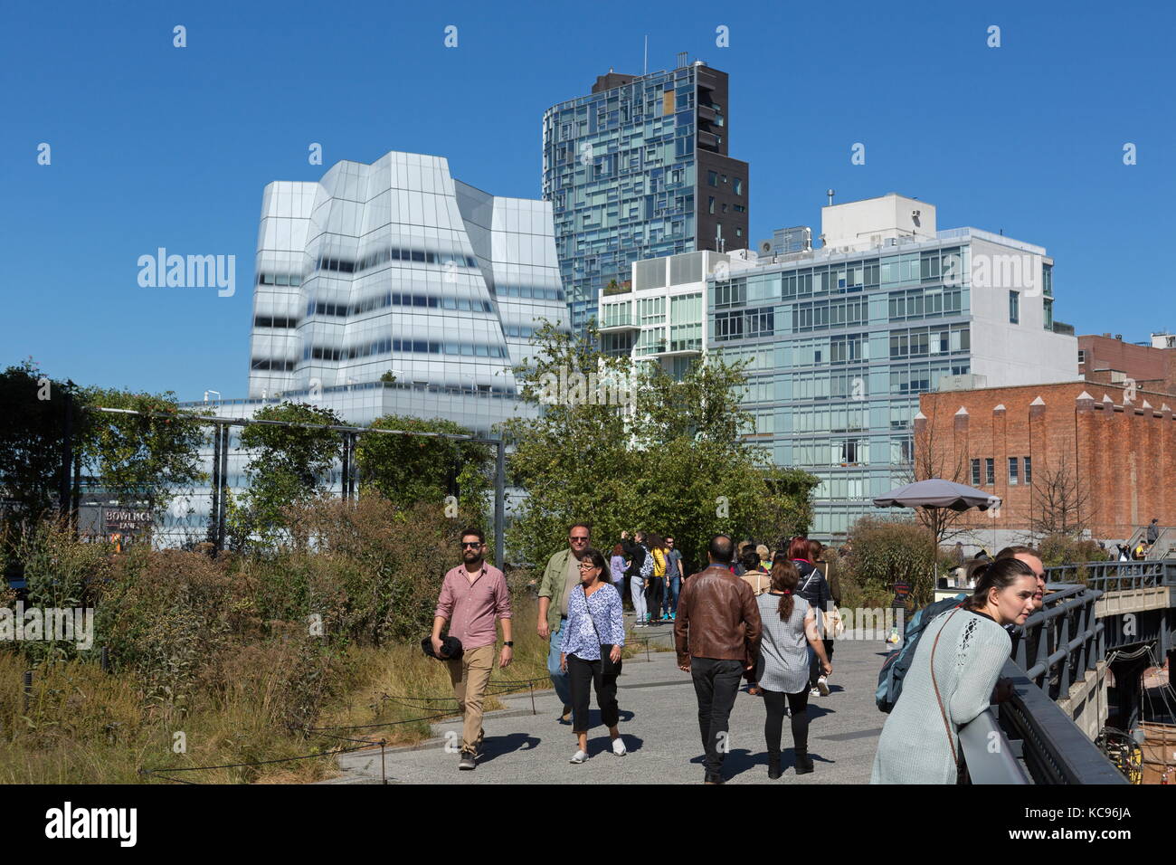 Pedestrians walk along the High Line in New York, New York on October ...
