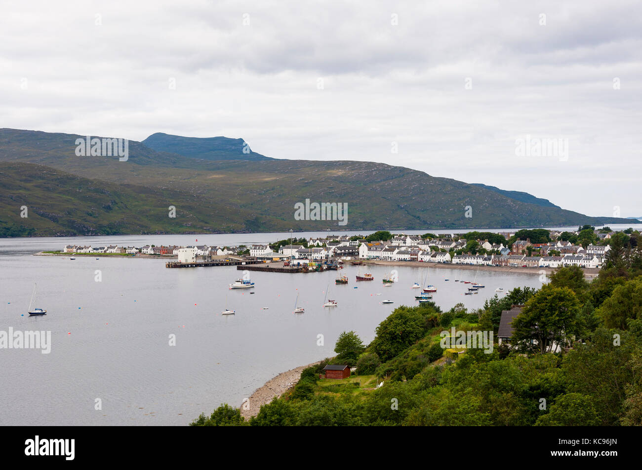 Ullapool, Scotland - August 15, 2010: View of the fishing port and the ...