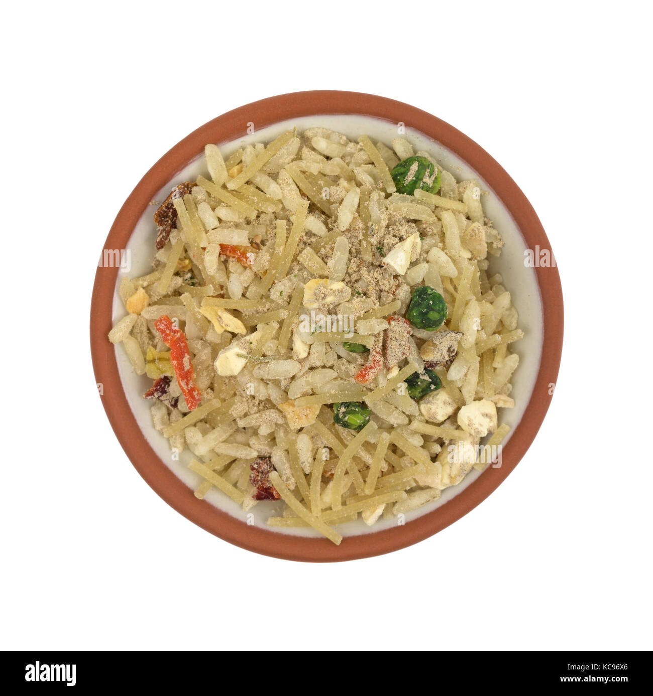 A small bowl filled with the dry ingredients for beef flavored rice ...