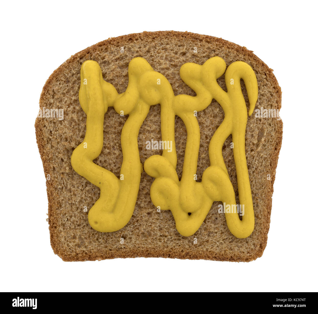 Top view of a piece of stone ground wheat bread with mustard isolated ...