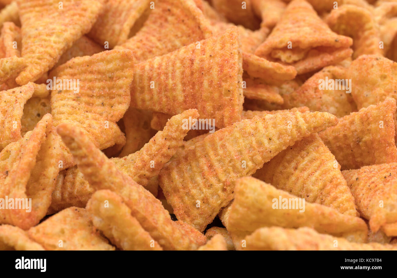 Close view of cheese flavored cone shaped corn chips Stock Photo - Alamy