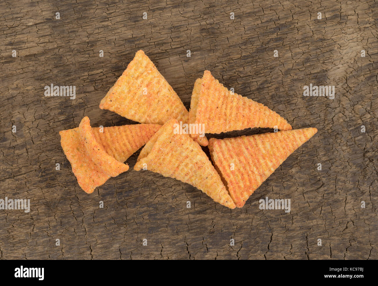 Top view of a small serving of cheese flavored cone shaped corn chips ...