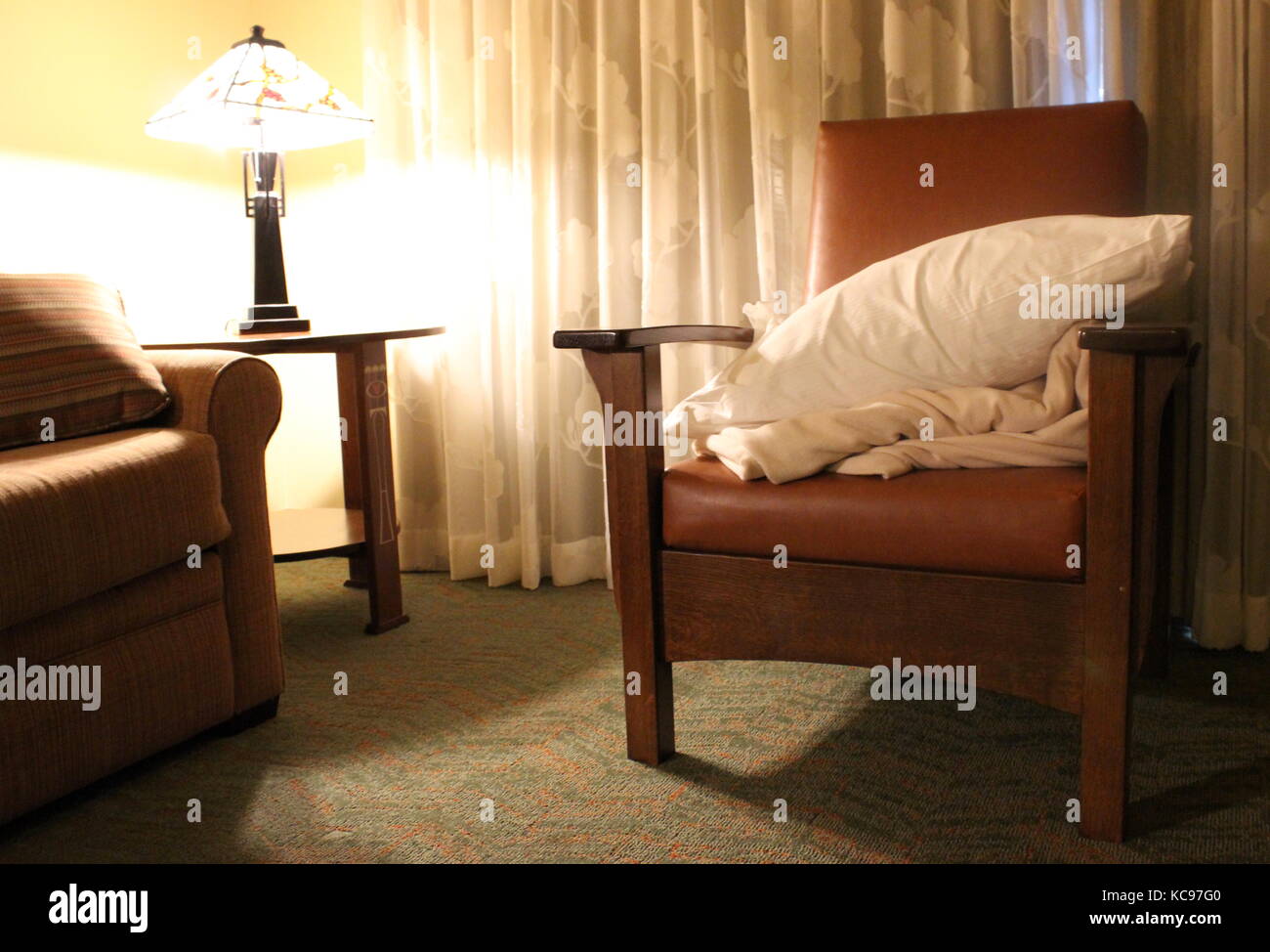 Chair with Pillow and Folded Sheets Stock Photo - Alamy