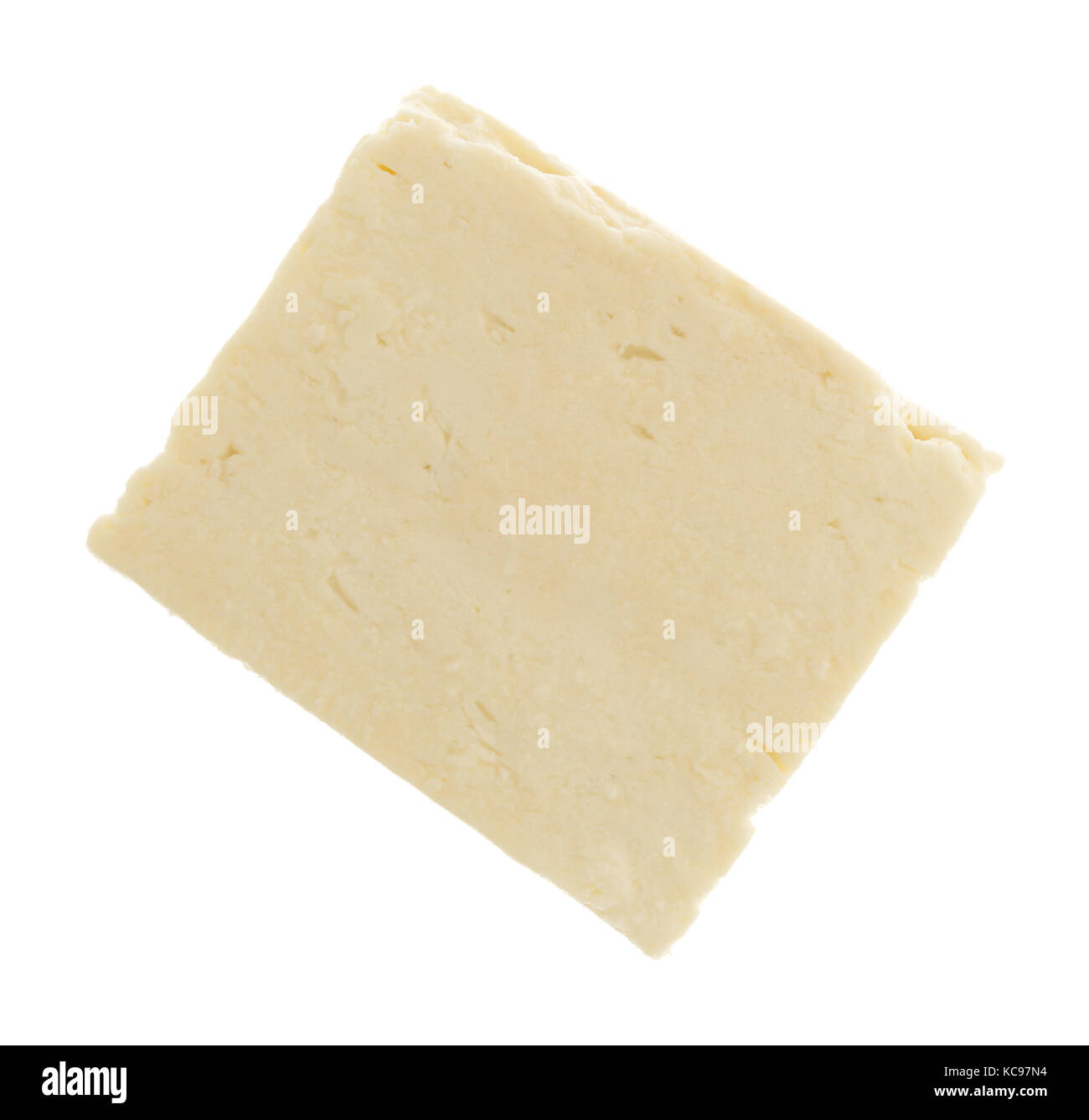 Top view of a large block of feta cheese isolated on a white background ...