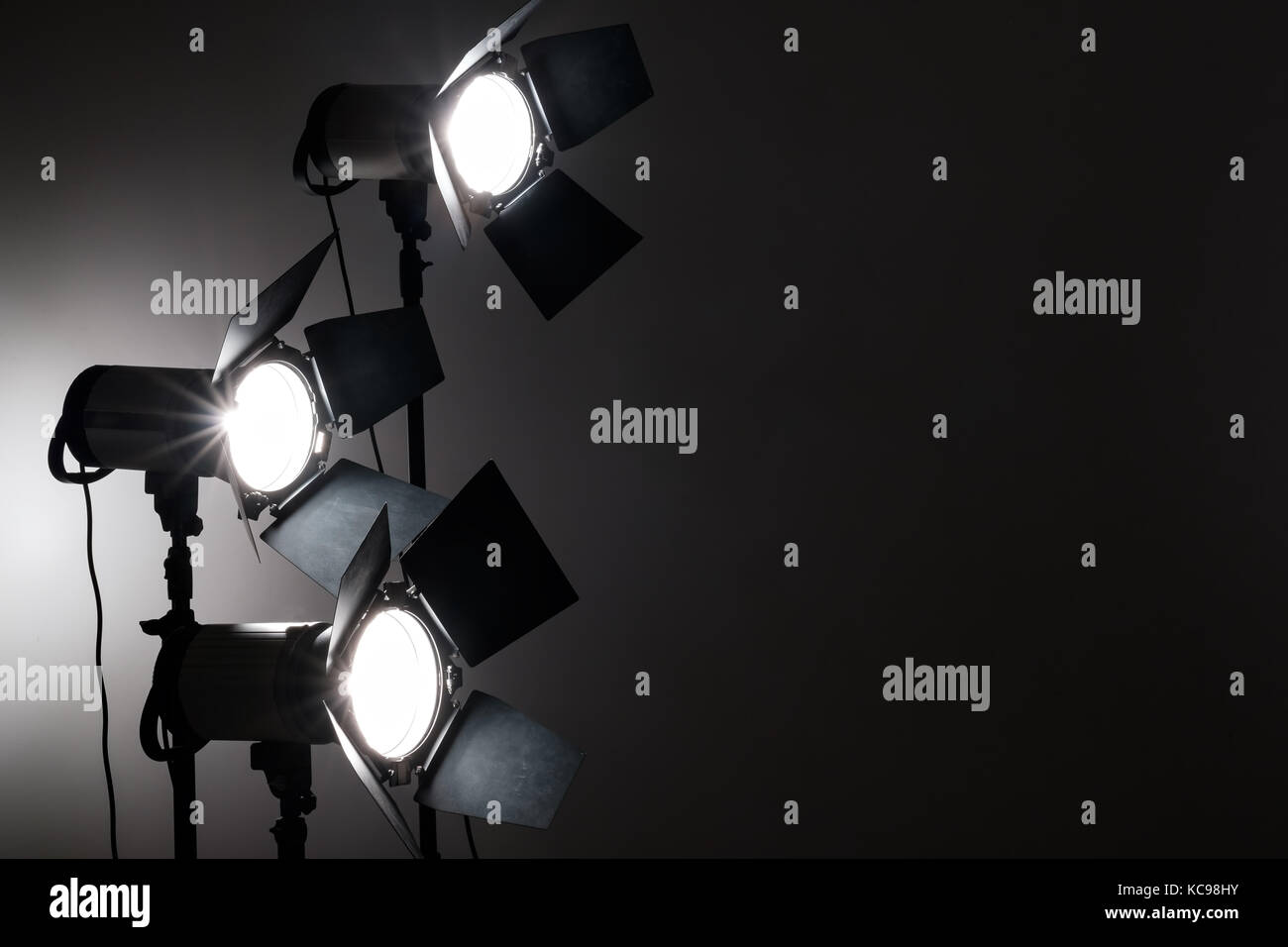 Several reflectors on the black background in photo studio Stock Photo ...