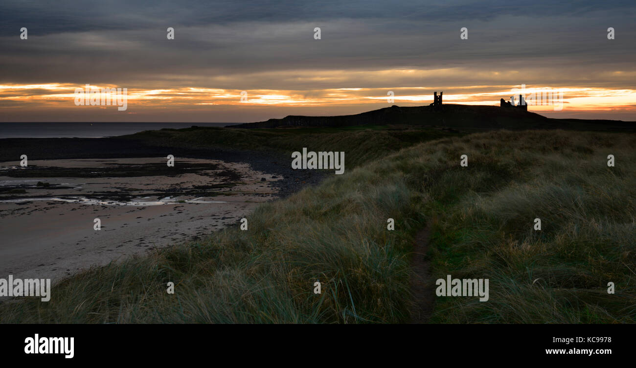 First light at Dunstanburgh Castle Stock Photo - Alamy