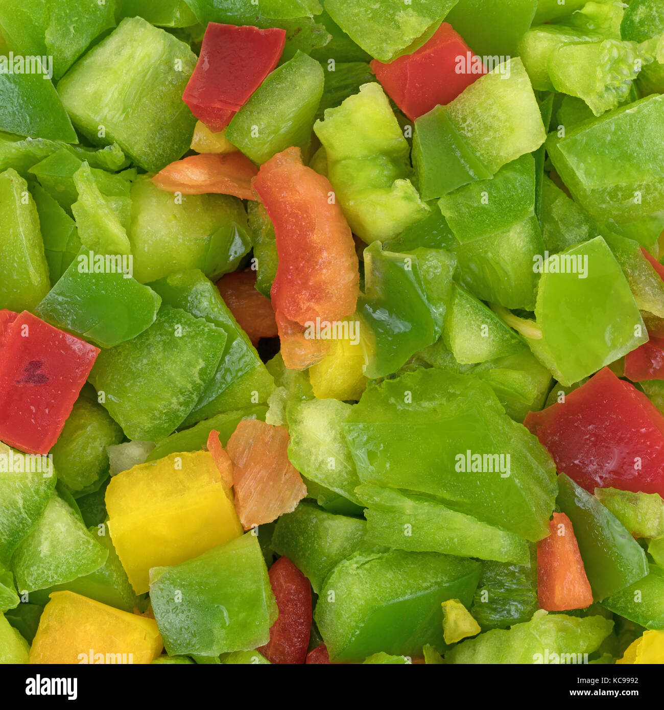 Close view of chopped red, yellow and green bell peppers Stock Photo ...