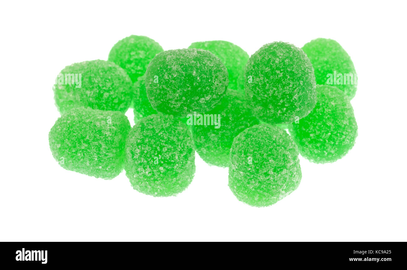 A small portion of green sugar coated sour drop candy isolated on a ...