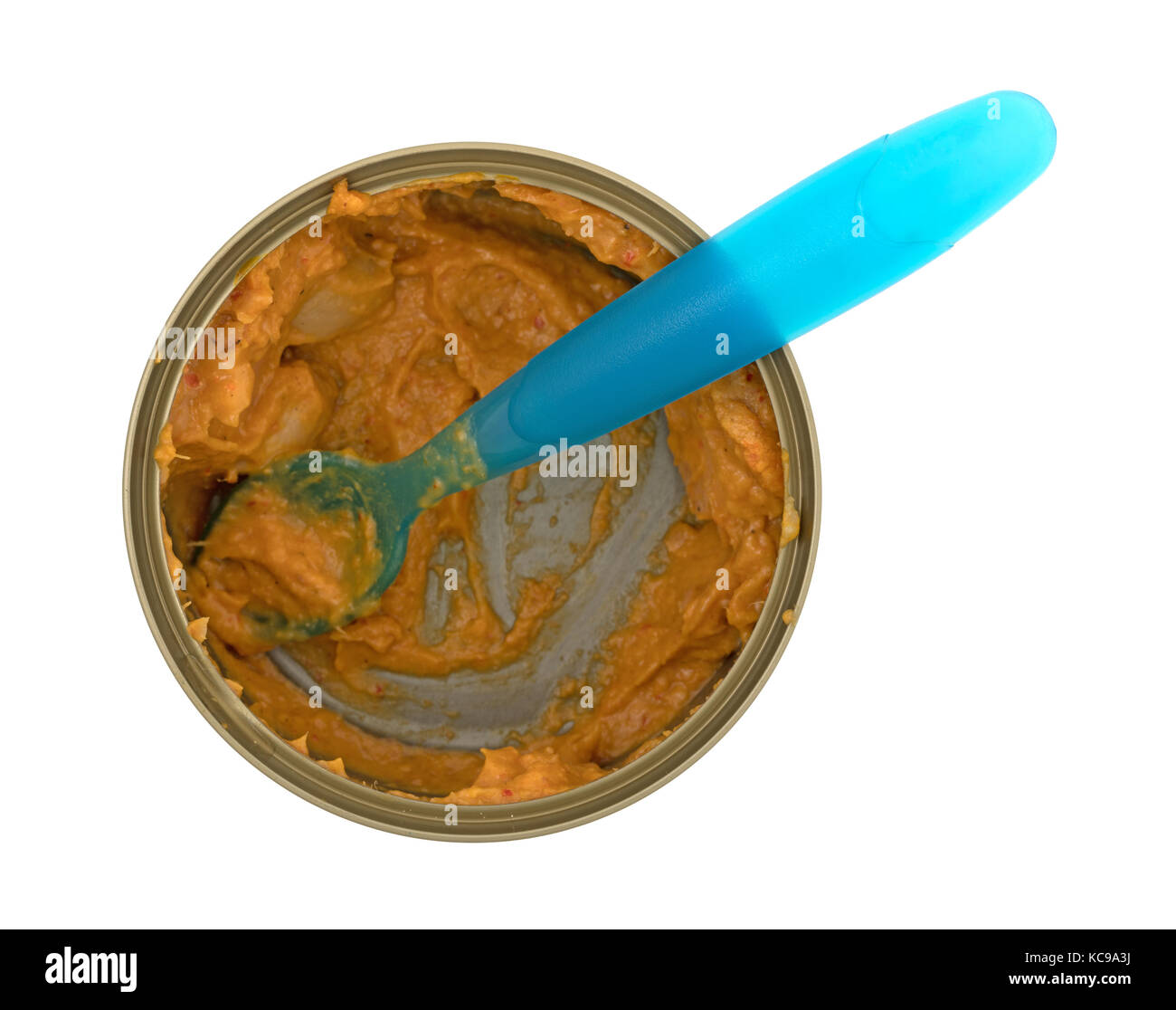 Top view of a can of red curry flavored tuna fish that has been mostly ...
