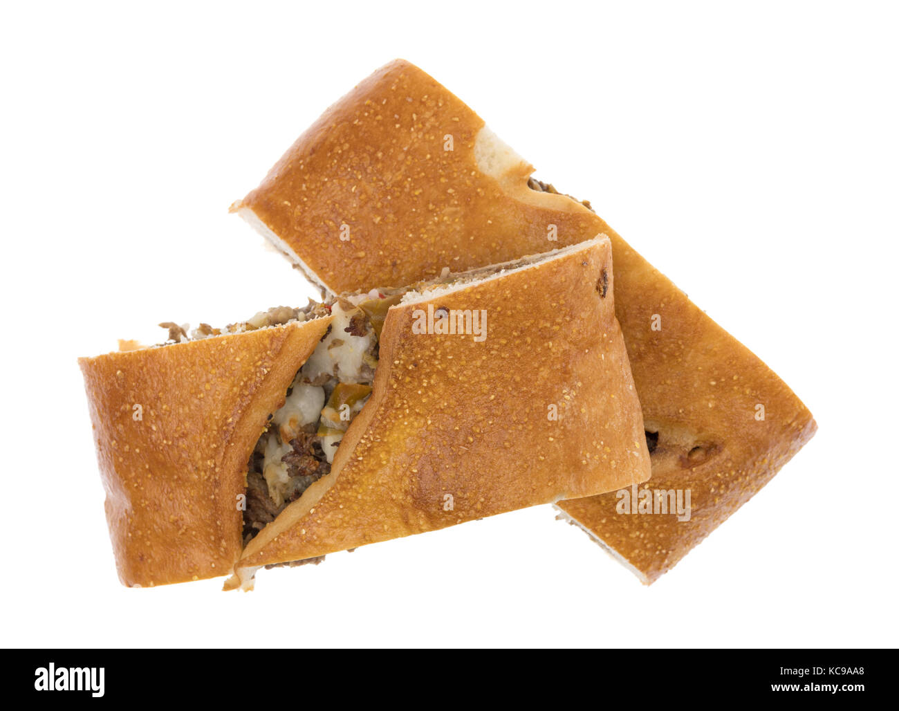 Top view of two slices of a baked steak stromboli isolated on a white ...
