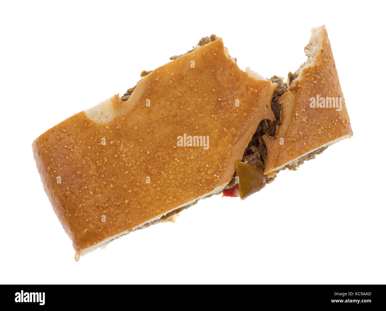 Top view of a bitten slice of baked steak stromboli isolated on a white ...