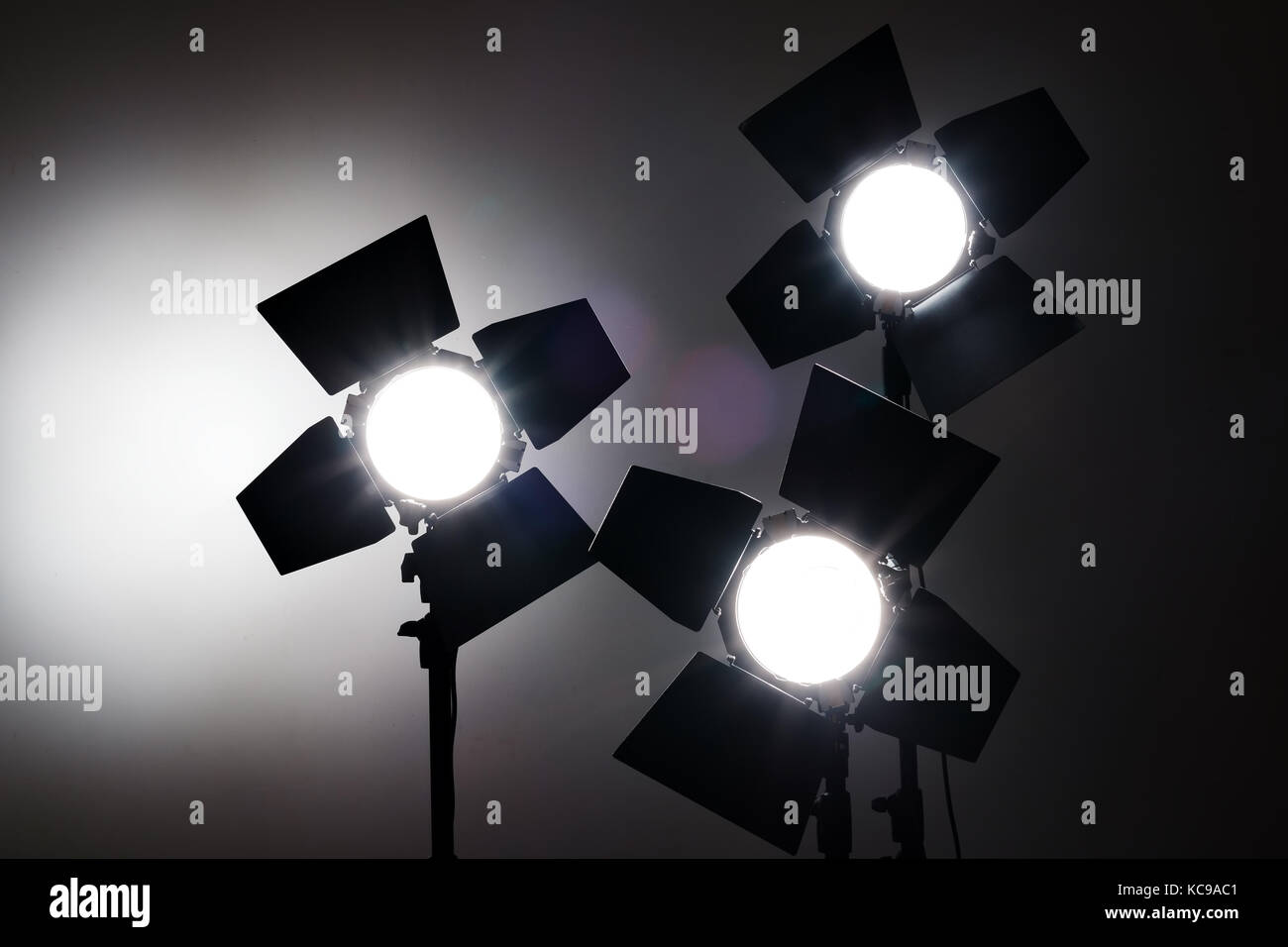 Several reflectors on the black background in photo studio Stock Photo ...