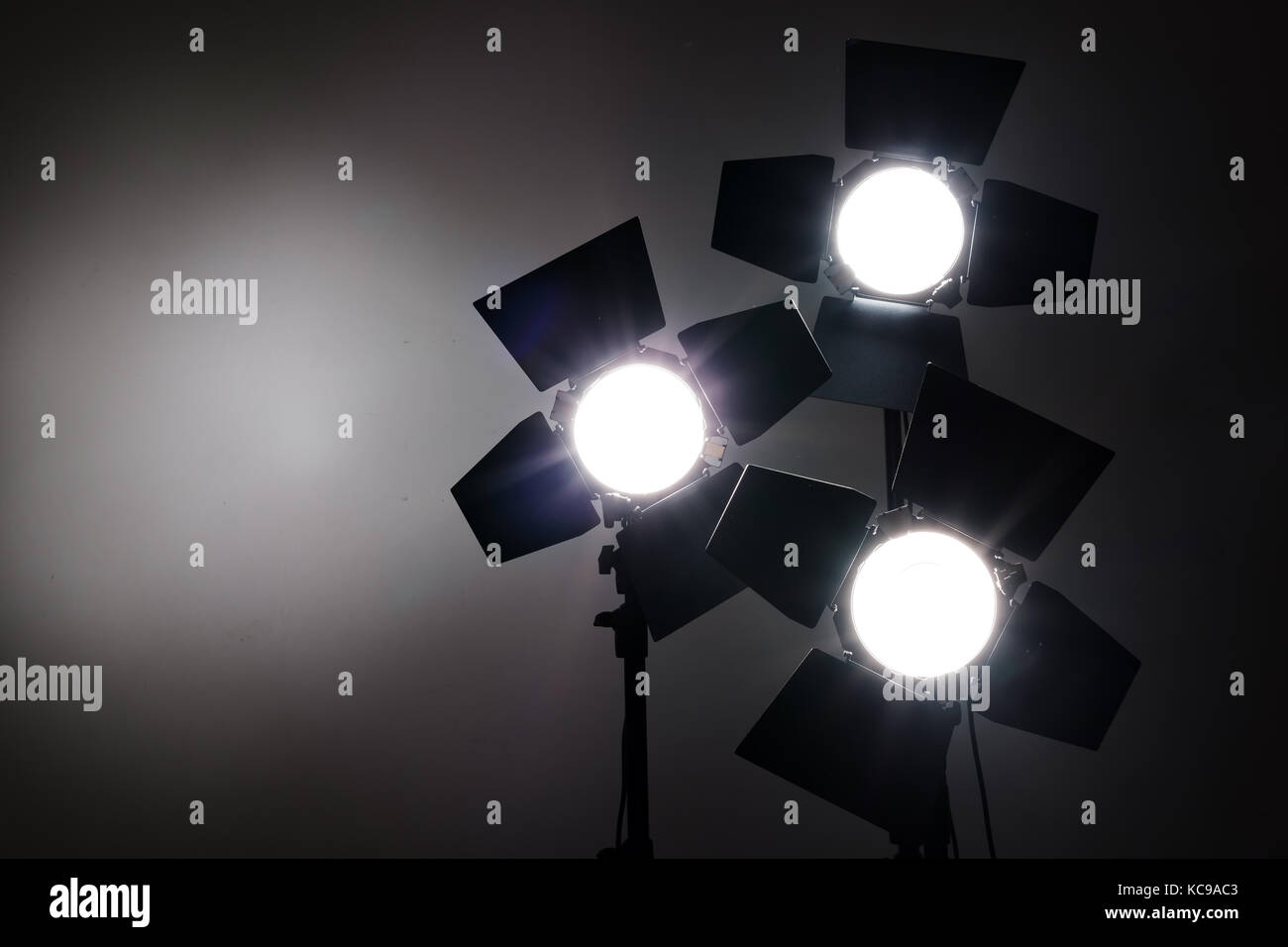Several reflectors on the black background in photo studio Stock Photo ...