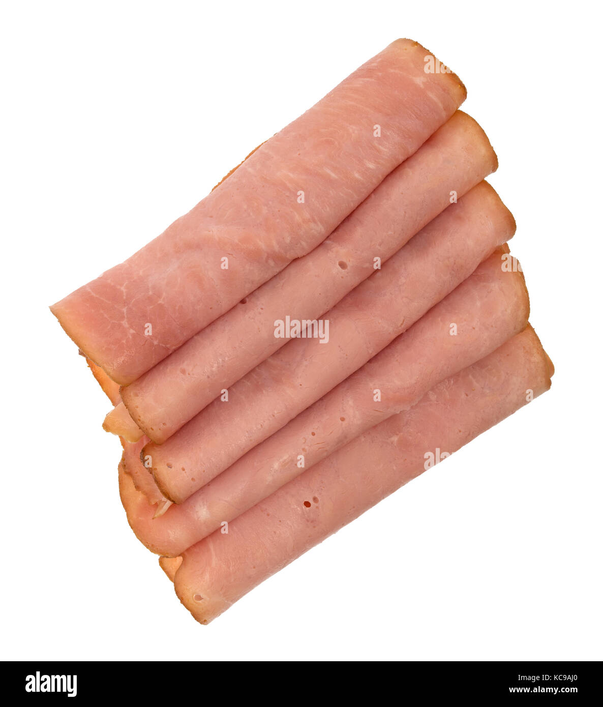 Five folded slices of Virginia ham in a row isolated on a white ...