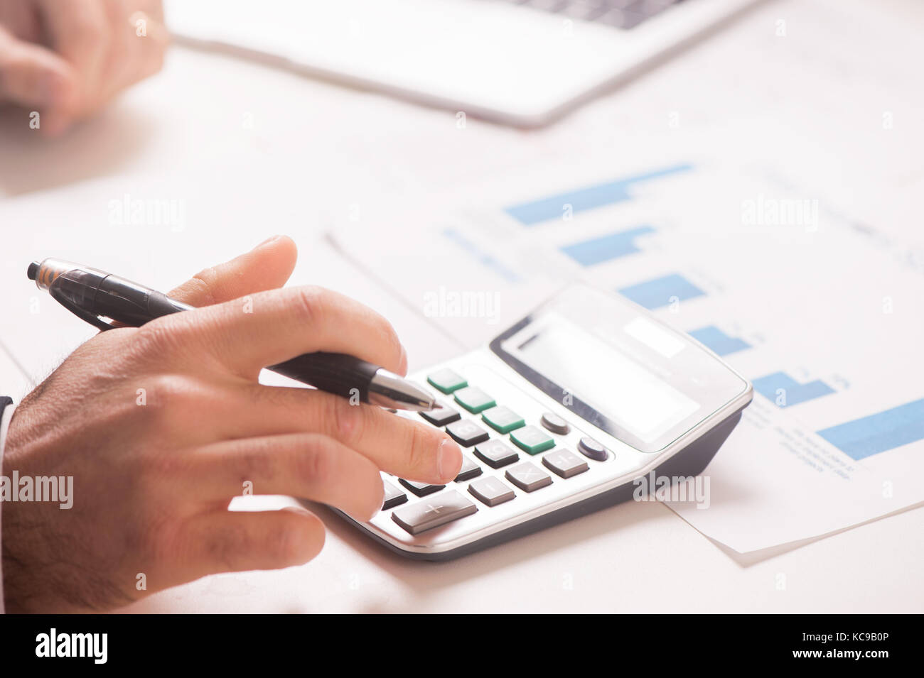 Hand Writing Make Note And Calculate Stock Photo - Alamy