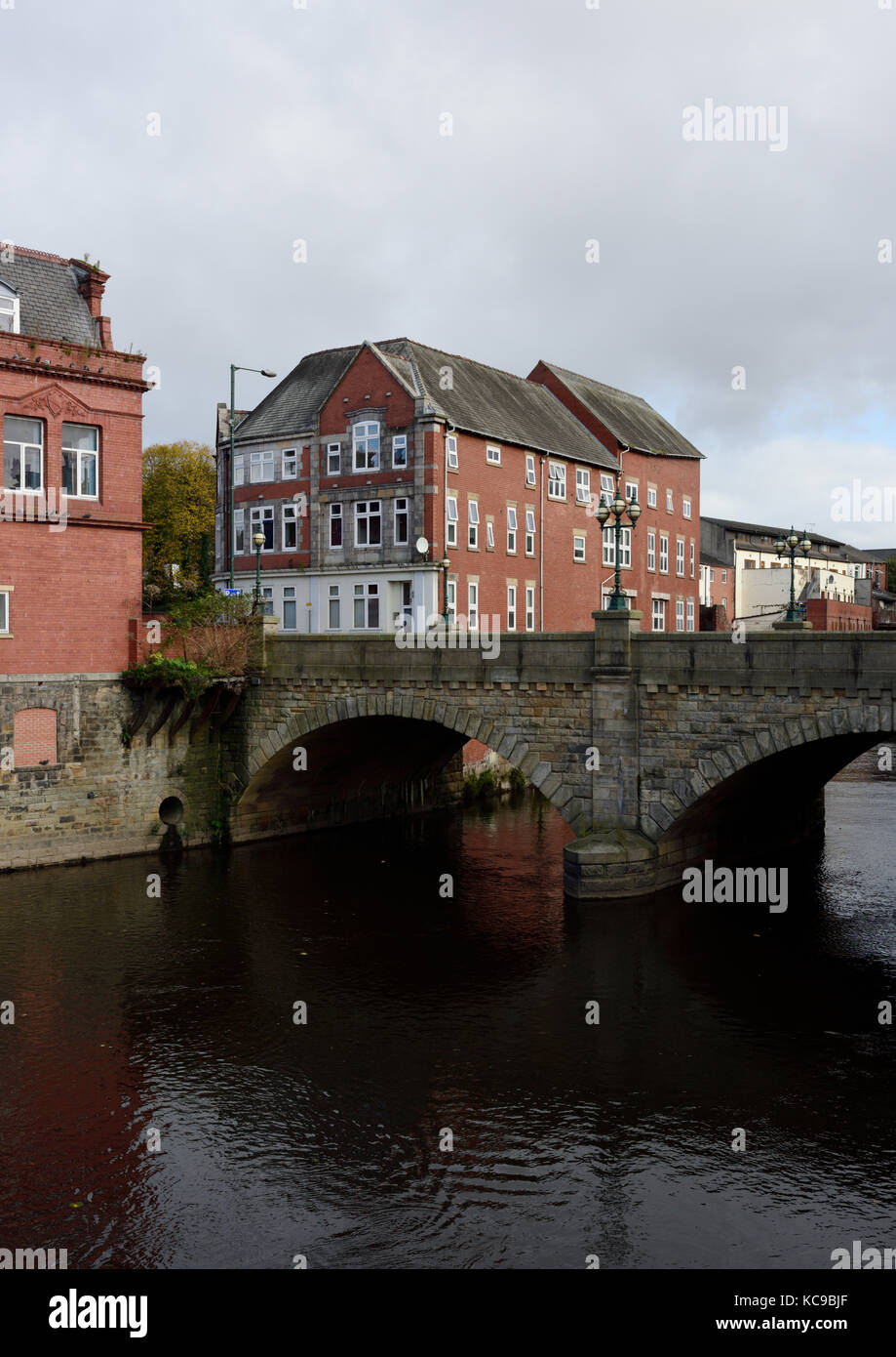 Bridge over river Irwell and riverside buildings at radcliffe in bury ...