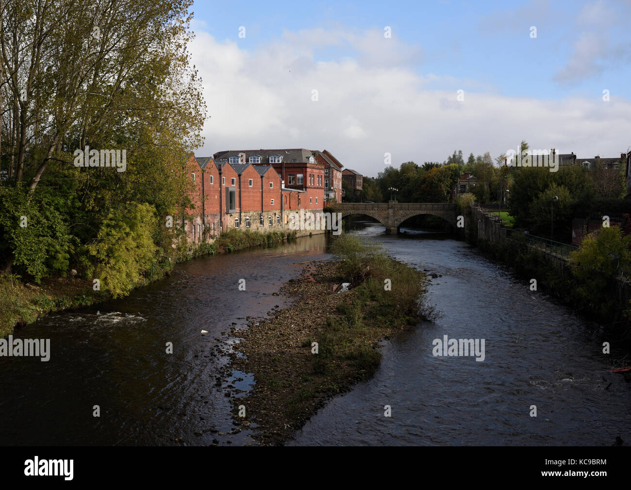 Gravel shoal and vegetation in river irwell at radcliffe in bury ...