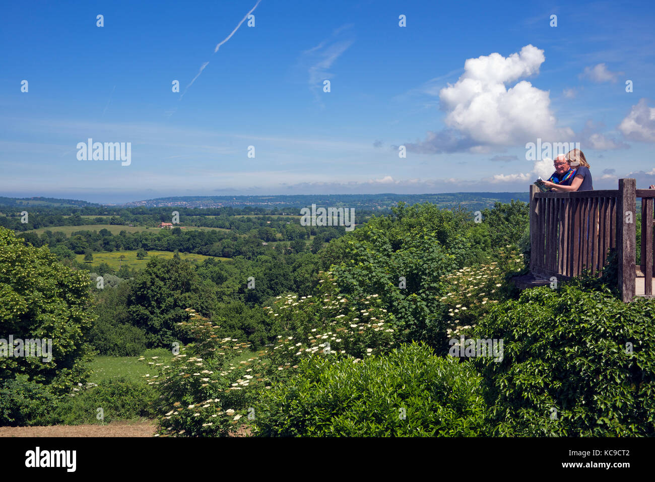 Couple admiring the view of Calvados countryside from Beaumont en Auge ...