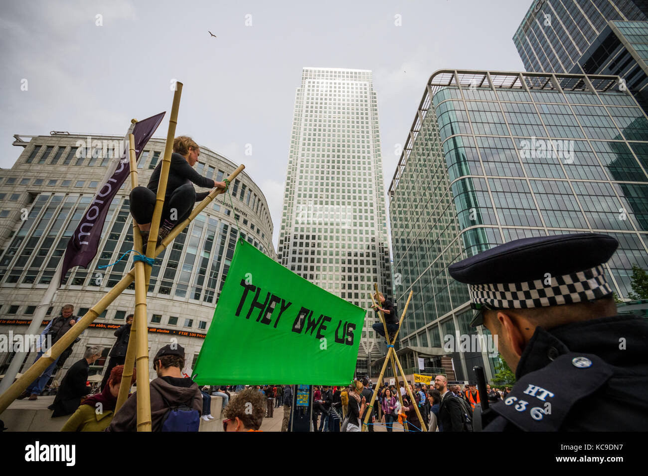 ‘They Owe Us’ protest at Canary Wharf in east London sees climate ...