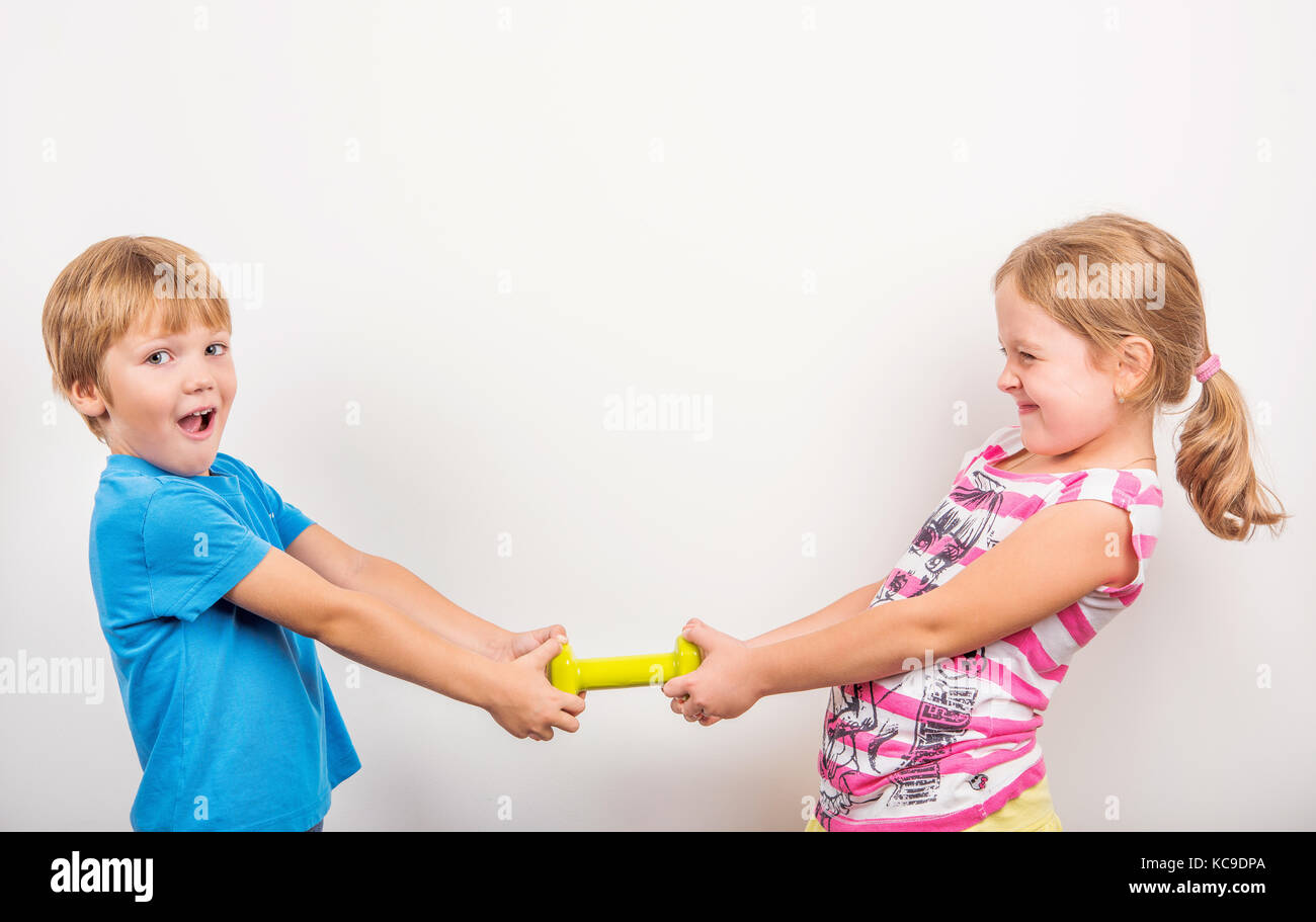 funny kids with dumbbells Stock Photo - Alamy