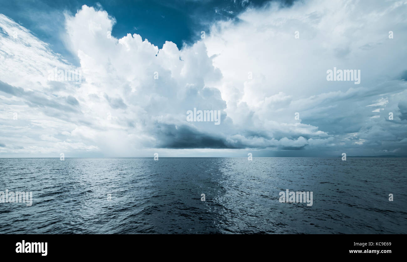 Dark clouds in open ocean Stock Photo - Alamy